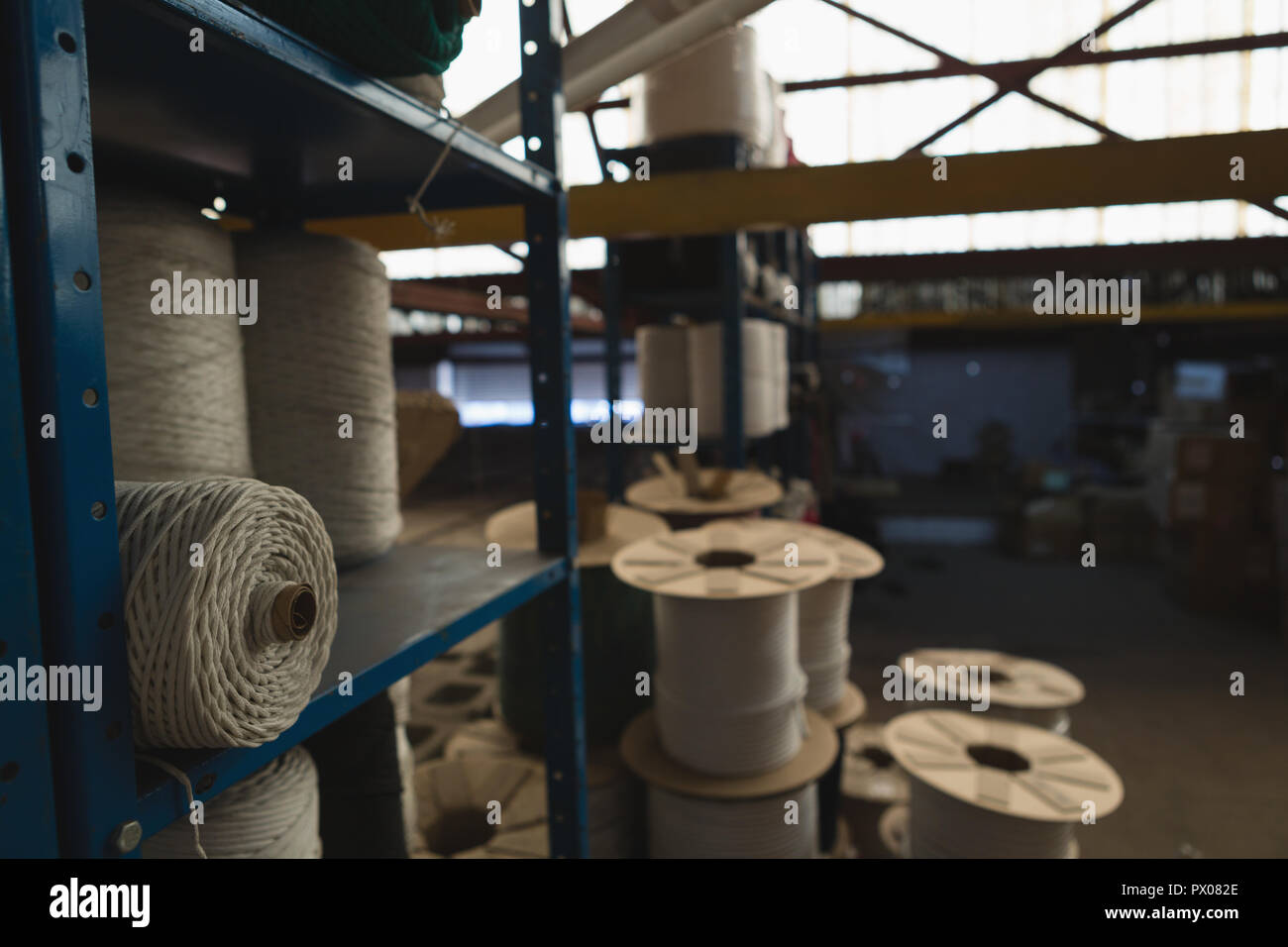 Rope roll arranged in pallet rack Stock Photo - Alamy