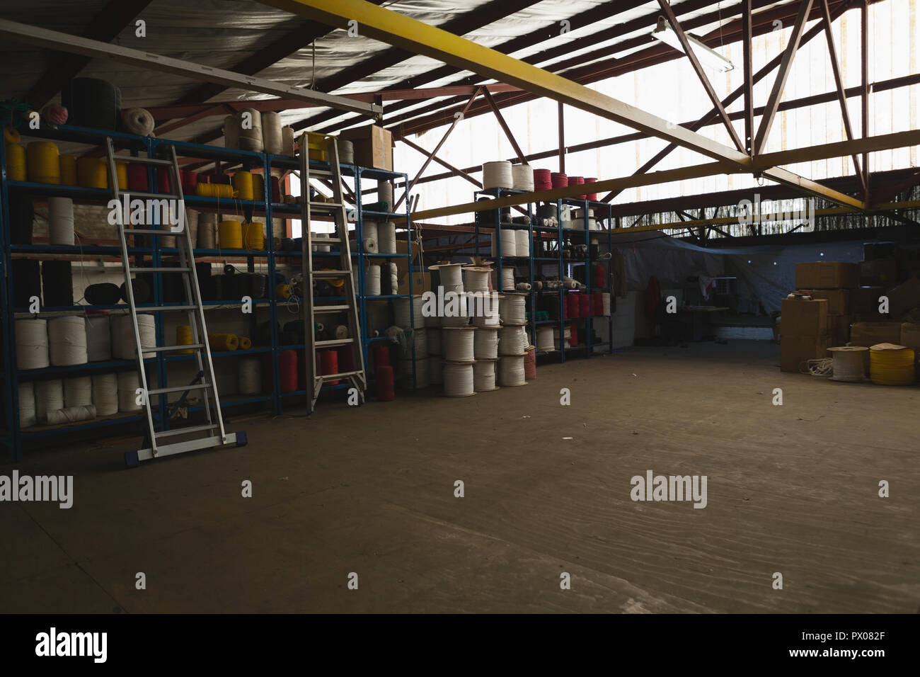 Rope roll arranged in pallet rack Stock Photo - Alamy