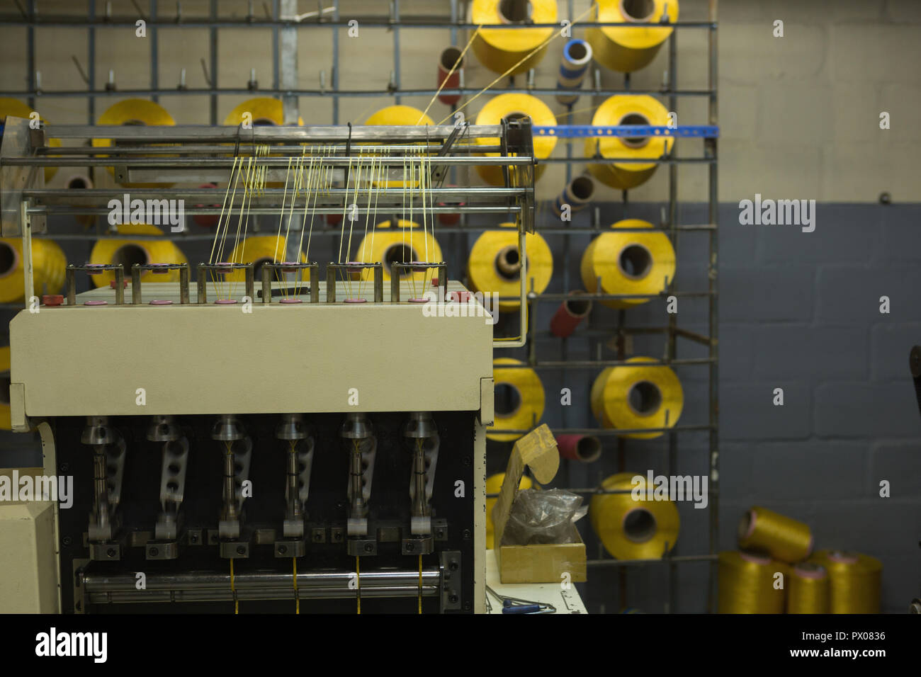 Thread roll arranged in pallet rack Stock Photo - Alamy