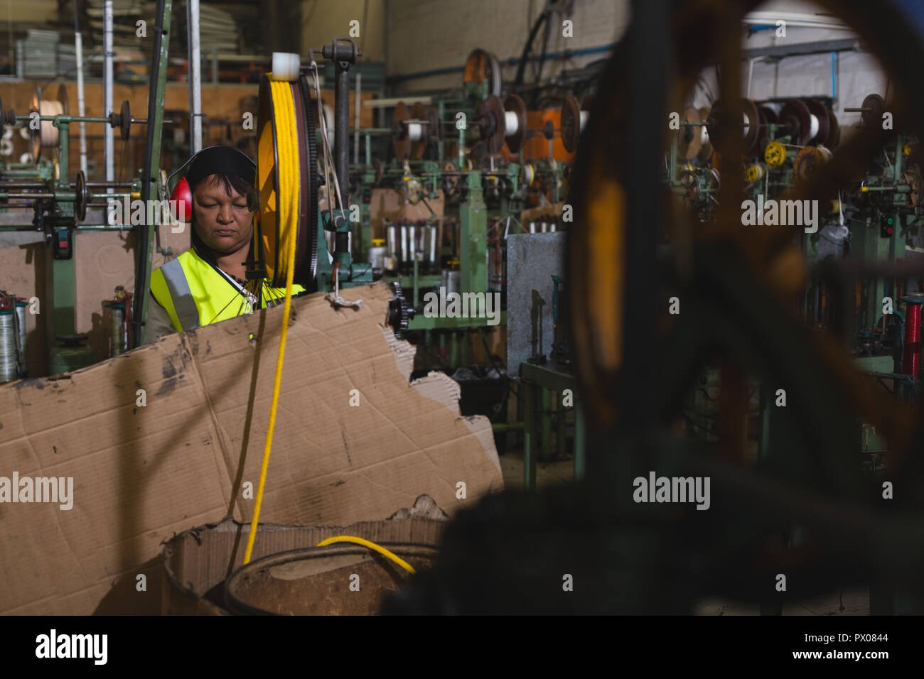 Woman working loom holding hi-res stock photography and images - Alamy