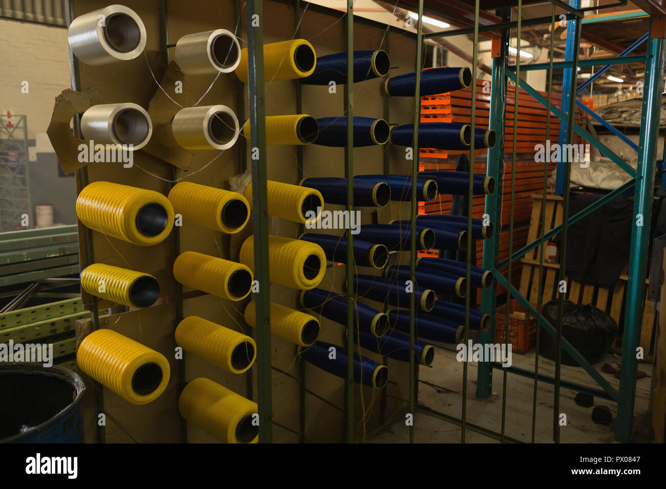 Thread roll arranged in rack Stock Photo - Alamy
