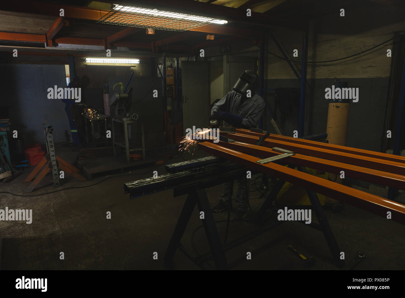 Male worker using grinder machine hi-res stock photography and images ...