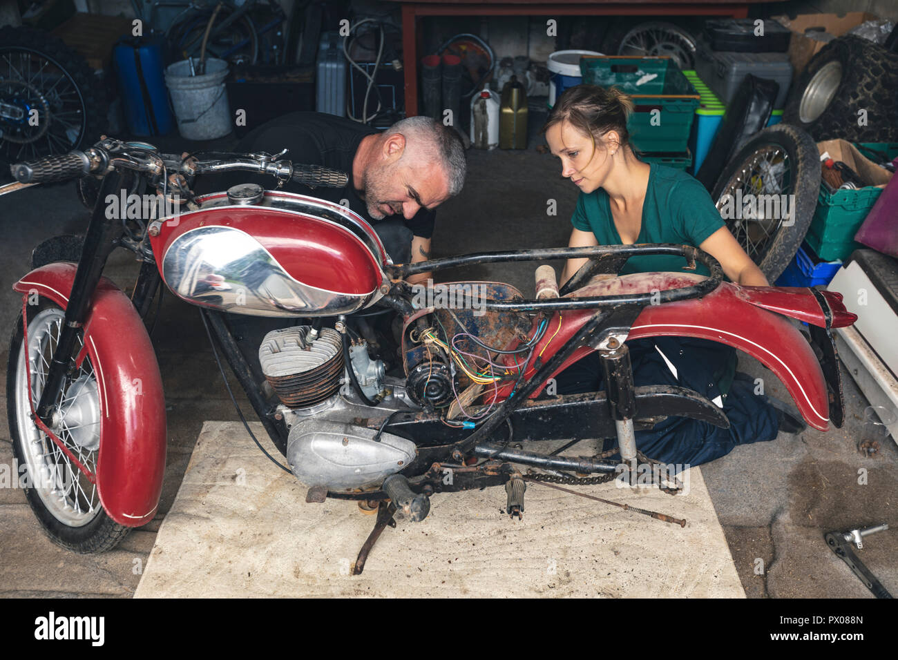 Male female motorbike mechanic hi-res stock photography and images - Alamy