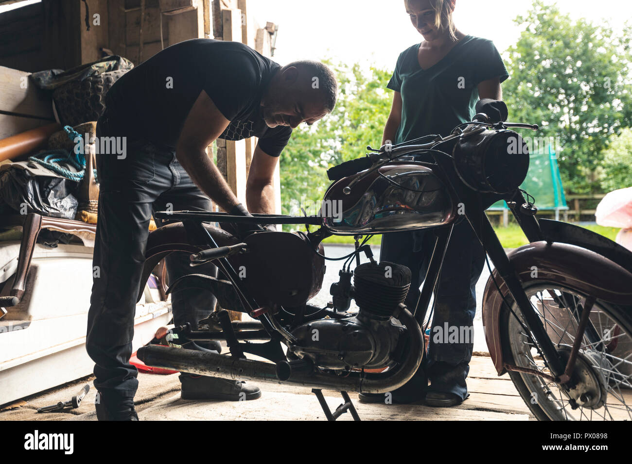 Male female motorbike mechanic hi-res stock photography and images - Alamy