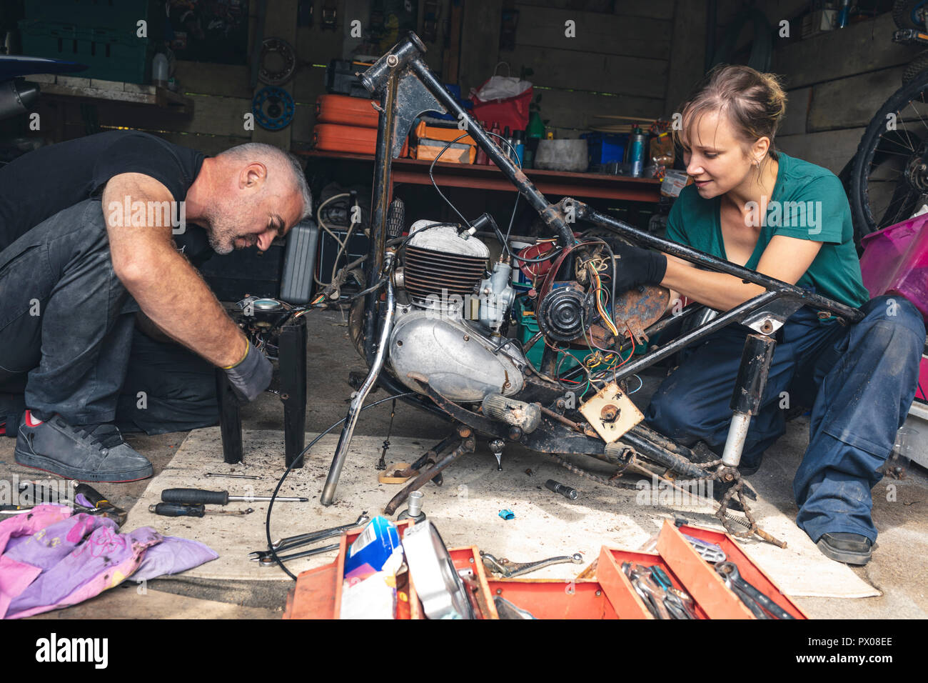 Male female motorbike mechanic hi-res stock photography and images - Alamy