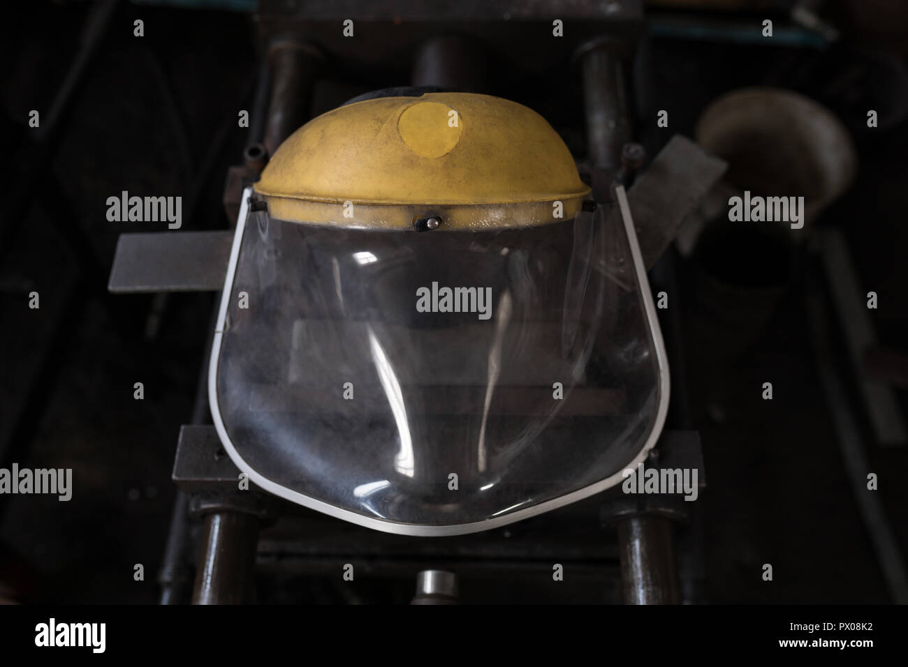 Protective helmet in workshop Stock Photo - Alamy