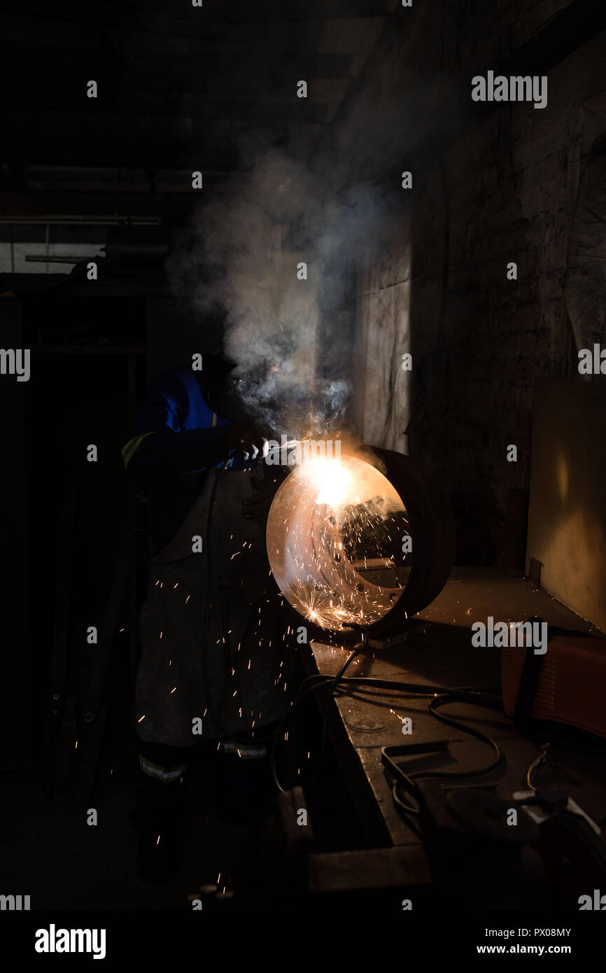 Metalsmith using welding torch in hi-res stock photography and images ...