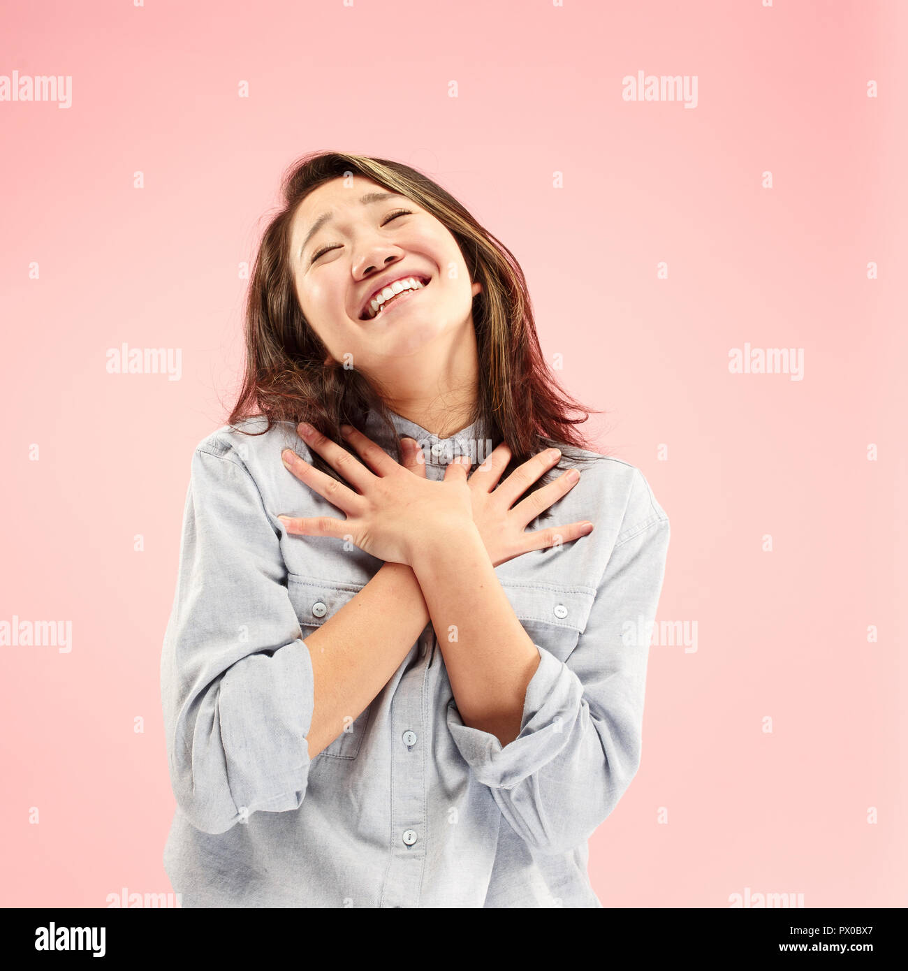 Delight. Beautiful female half-length front portrait isolated on pink ...