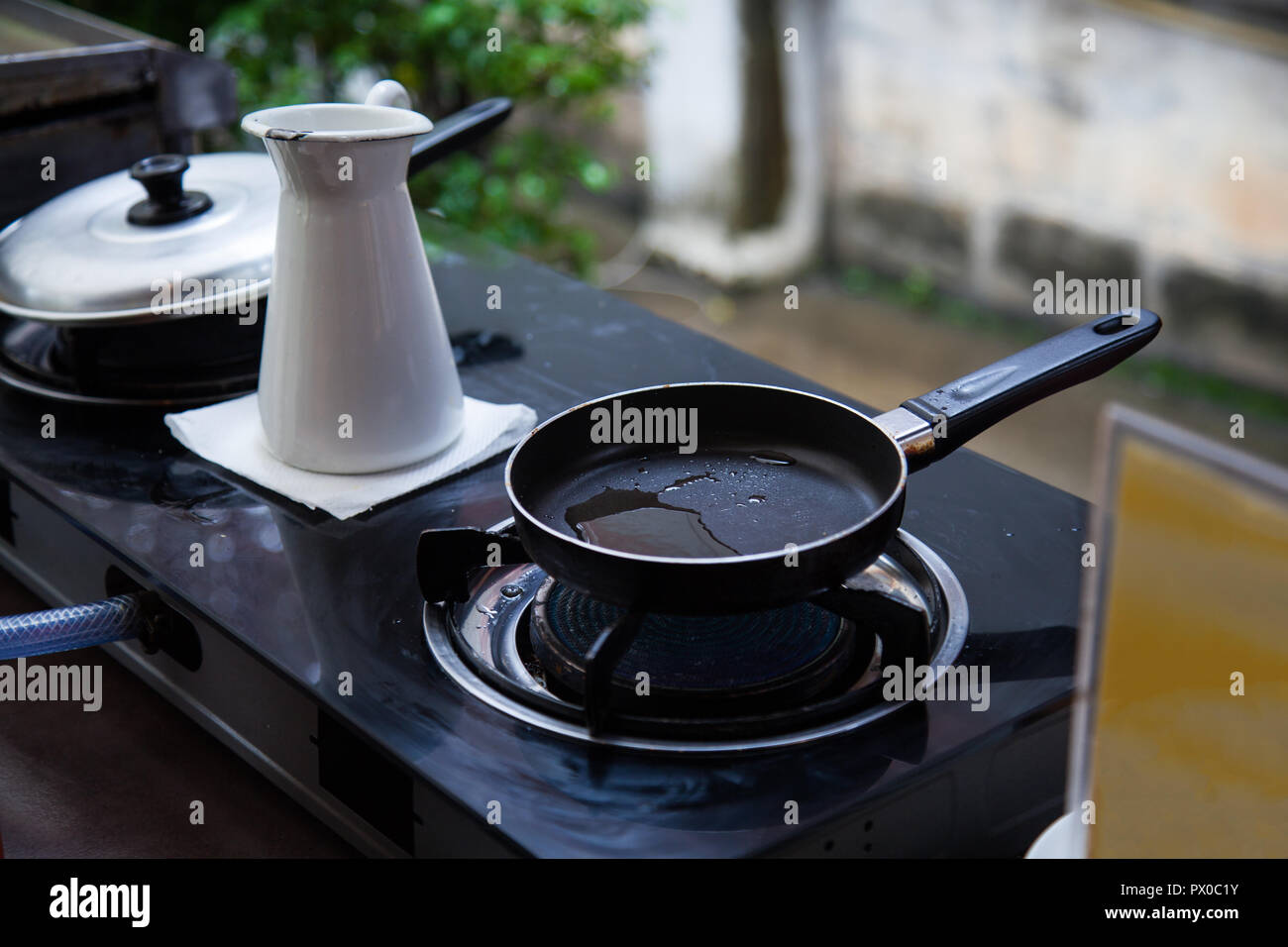 heating oil in stainless steel pan on gas fueled stove, prepared for ...