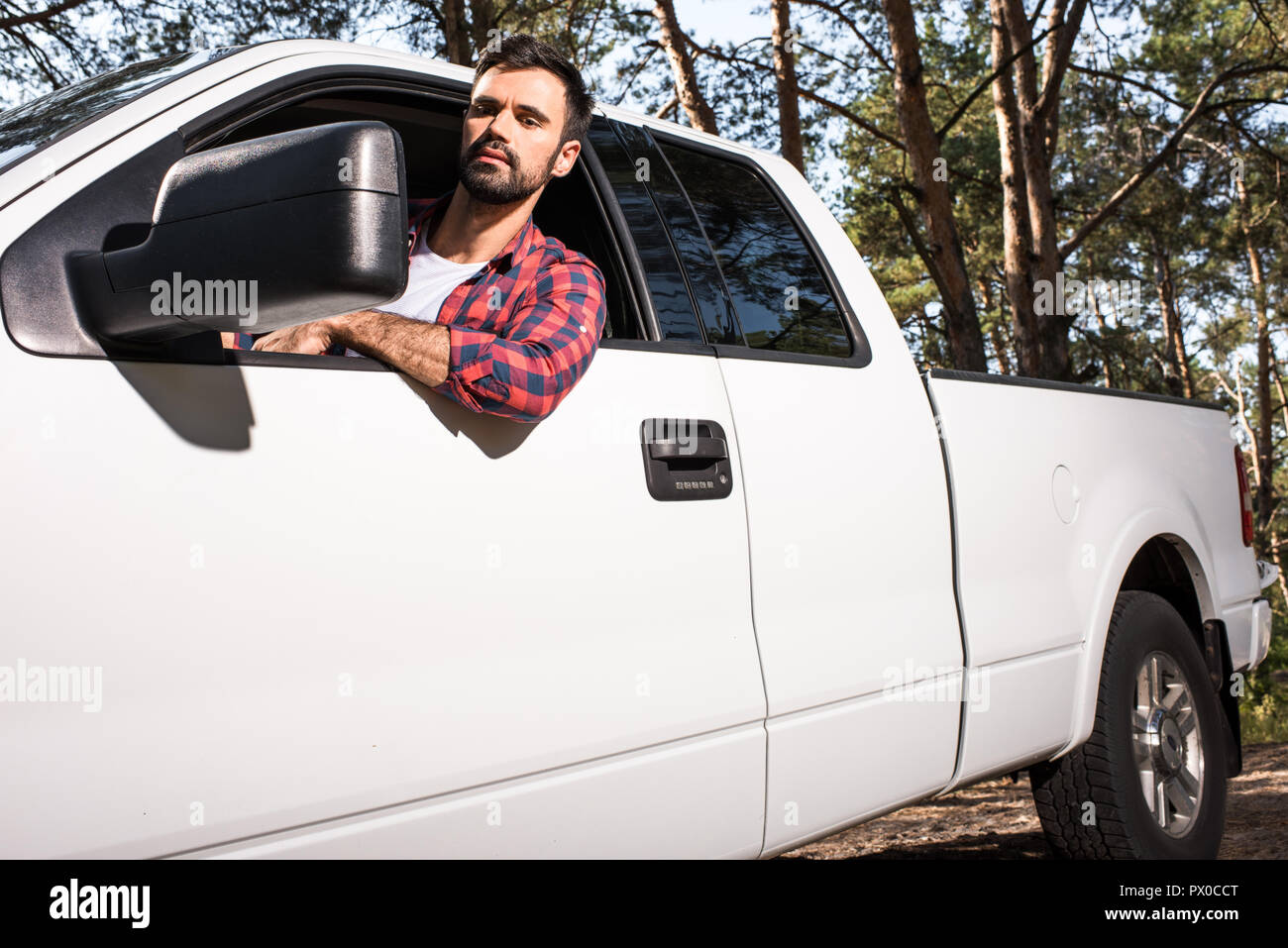 Young man sitting in an pick up truck hi-res stock photography and ...