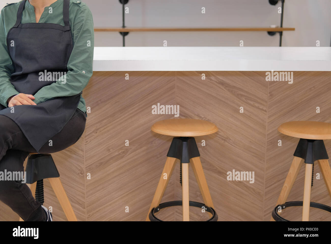 business owner wearing apron sitting at cafe coffee shop cafeteria ...