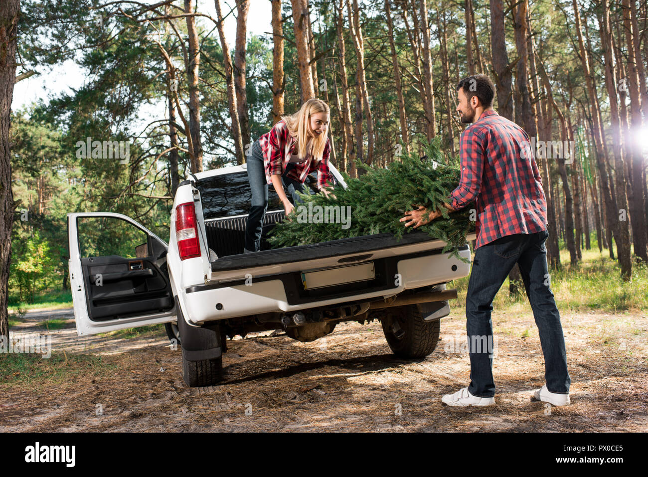Woman loading car trunk hi-res stock photography and images - Alamy
