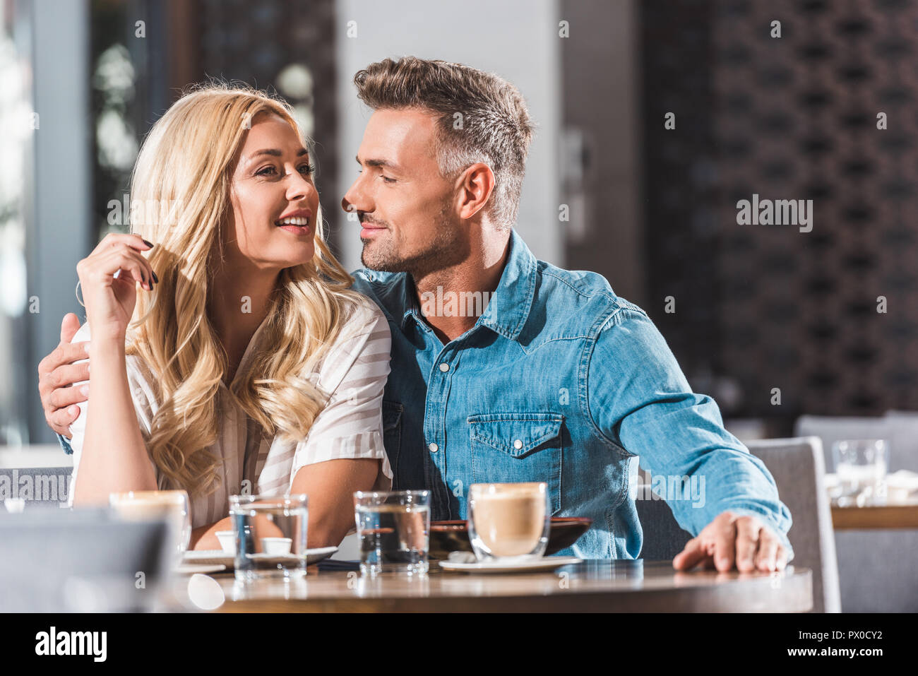Happy romantic couple hugging hi-res stock photography and images - Alamy