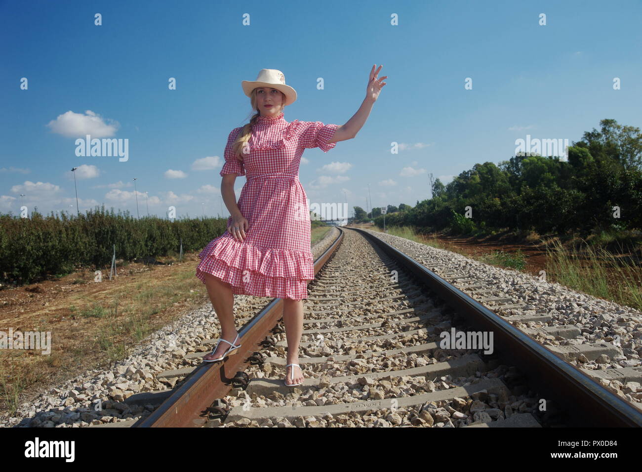 an amazing blonde woman ask for hitchhiking from loco, locomotive Stock ...