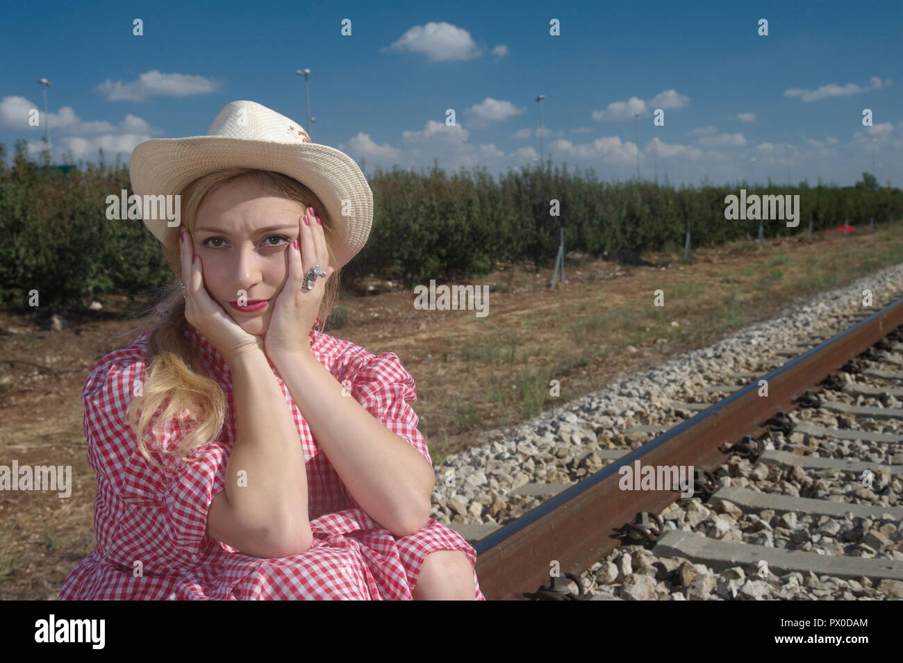 an amazing blonde woman ask for hitchhiking from loco, locomotive Stock ...