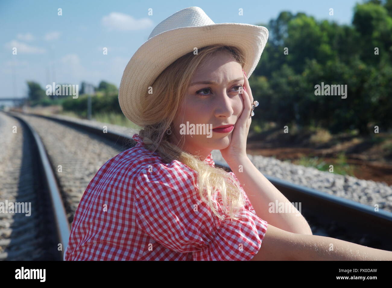 an amazing blonde woman ask for hitchhiking from loco, locomotive Stock ...