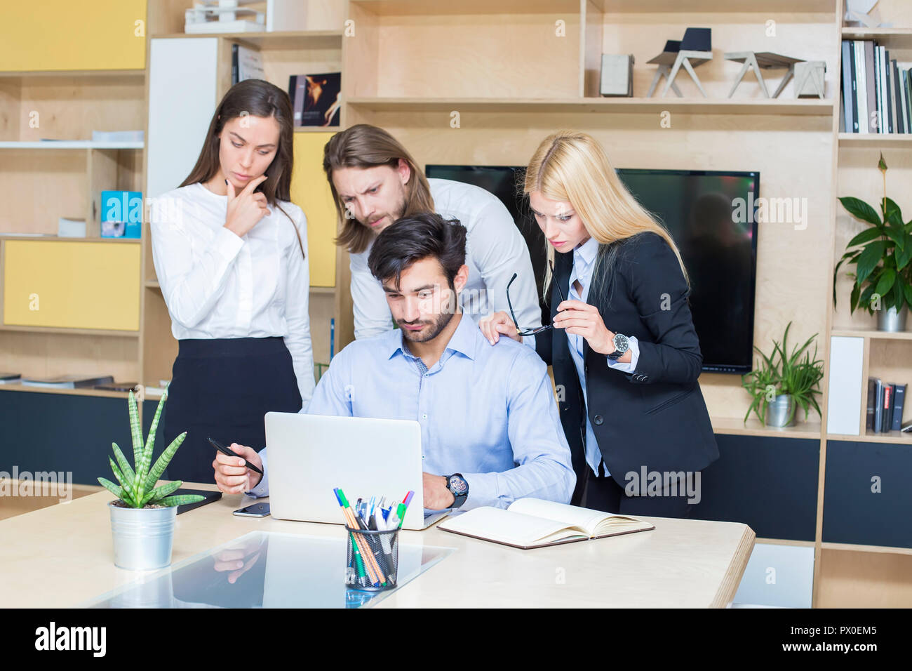 Cheerfull business team working together to achieve better results ...