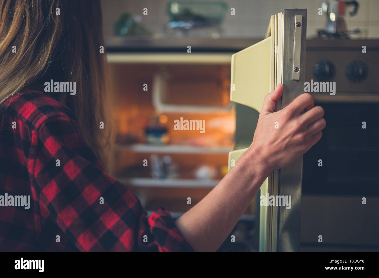 Refrigerator door woman hi-res stock photography and images - Alamy