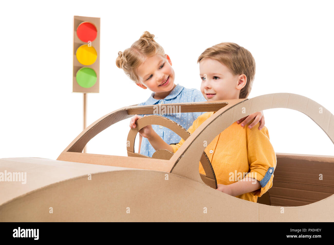 smiling kids playing with cardboard car and traffic lights, isolated on ...