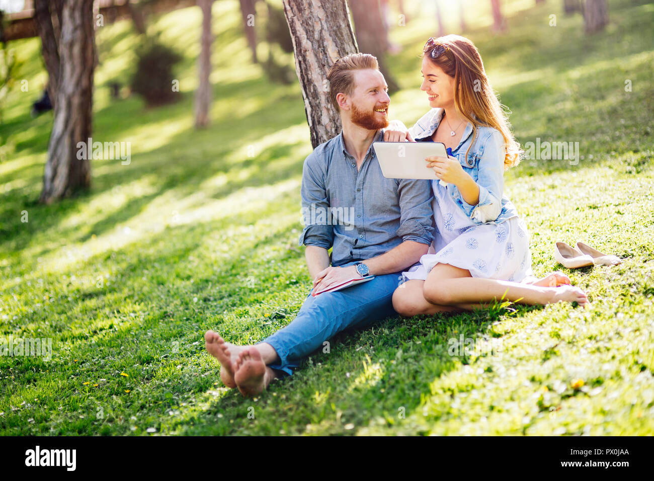 Beautiful couple studying together for exams Stock Photo - Alamy