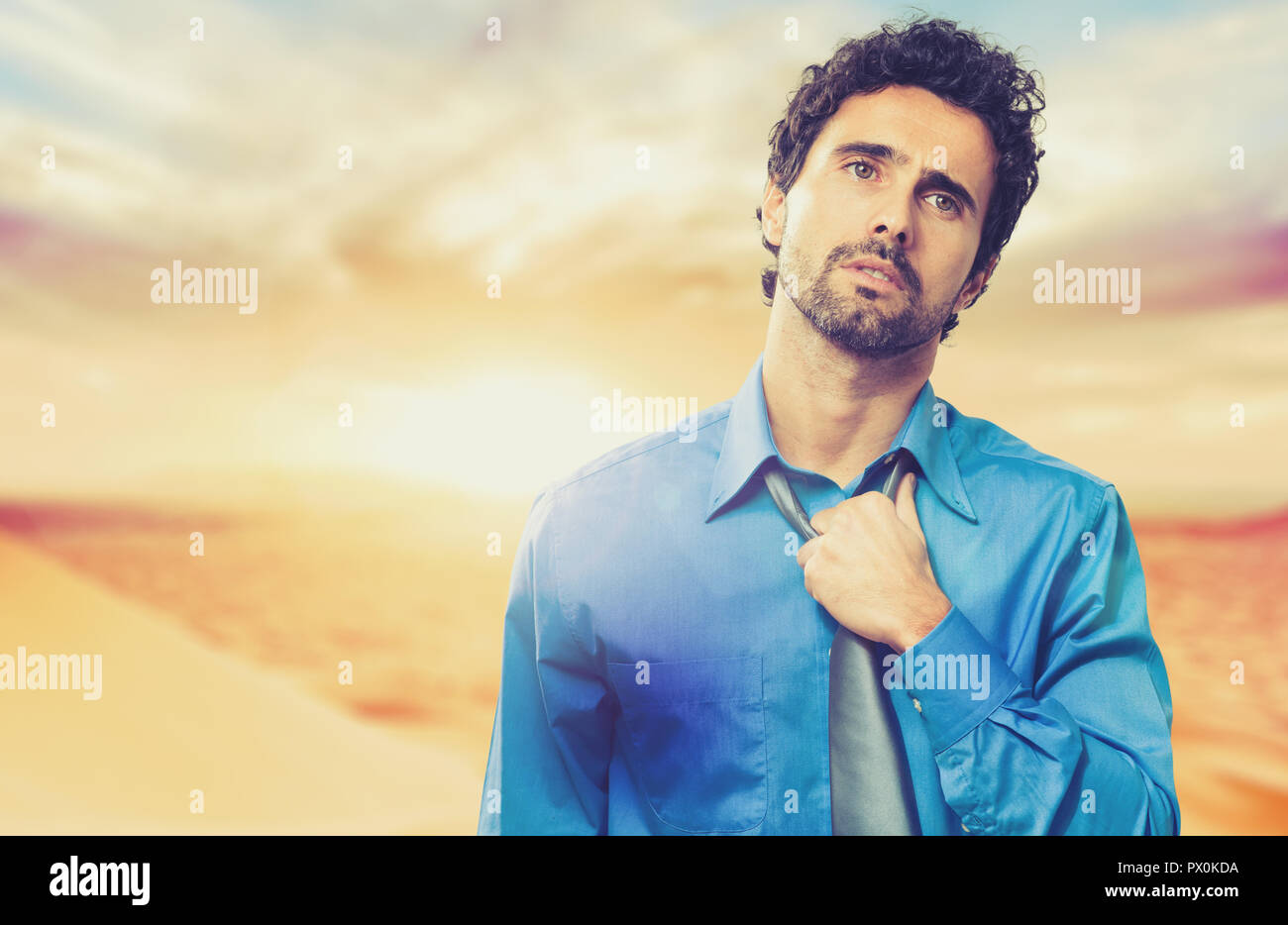 Fired businessman sweating in the desert Stock Photo - Alamy