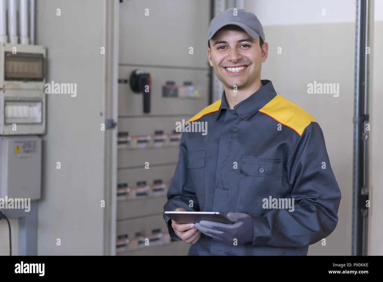 Portrait of an electrician at work Stock Photo - Alamy