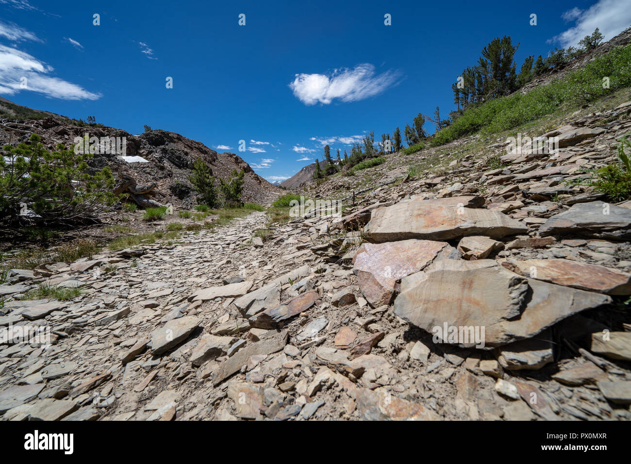 Very rocky trail of scree and talus rocks along the 20 Lakes Basin loop ...