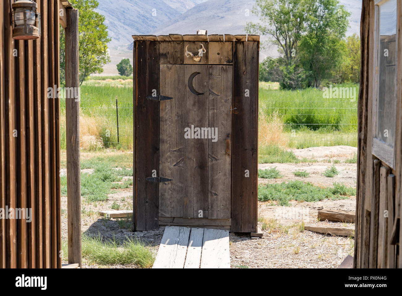 Old fashioned wooden outhouse bathroom portable potty, out in the ...
