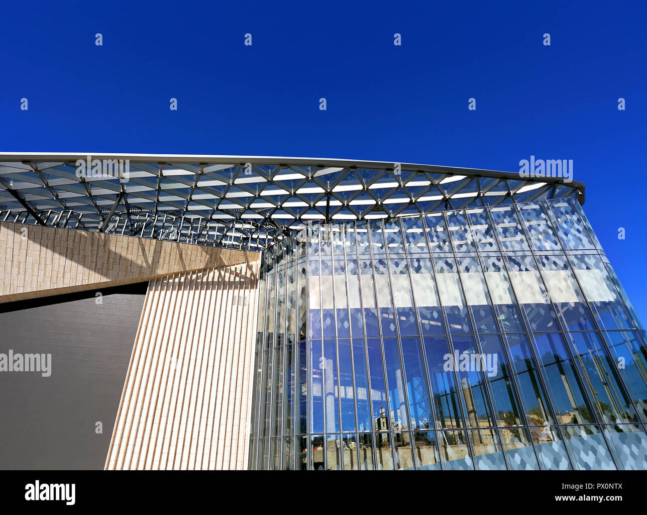 White wall of a large construction with a relief texture, a built-in ...