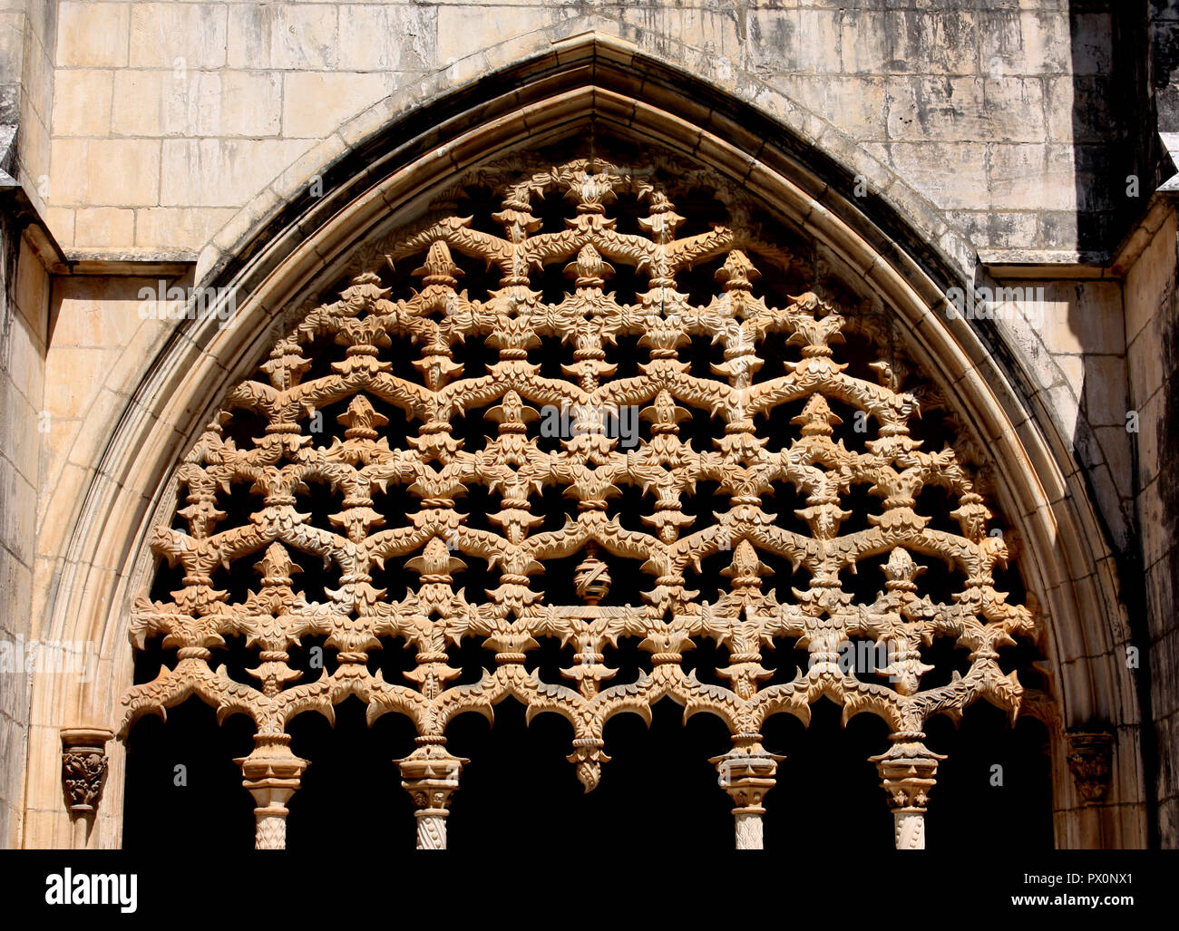 The decorated archways in The Royal Cloisters at Batalha Monastery ...
