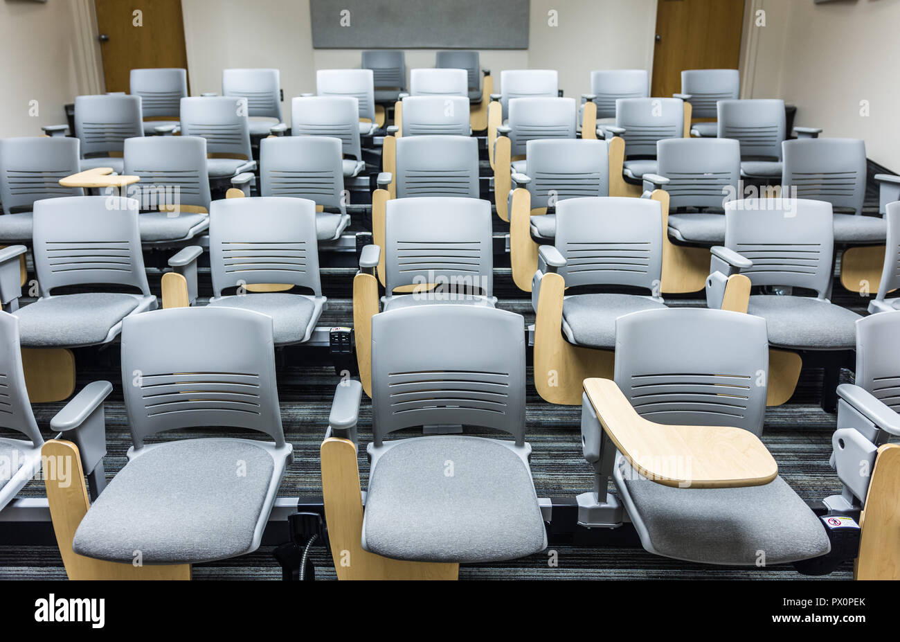 Adjustable desk seats in lecture hall or classroom, university, college ... Adjustable desk seats in lecture hall or classroom, university, college ...