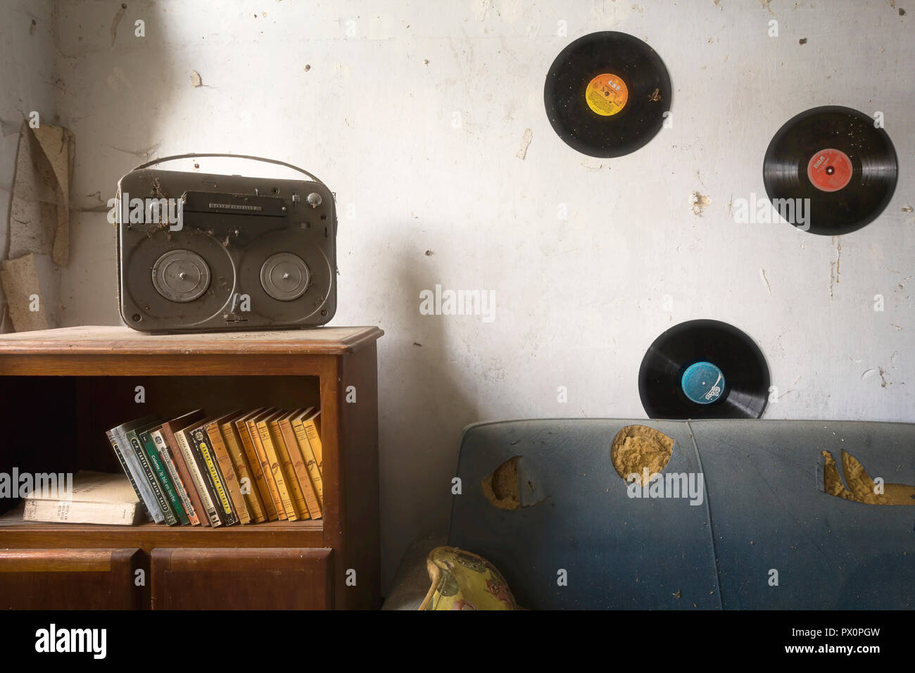 Interior view of room with old reel to reel tape recorder and records ...