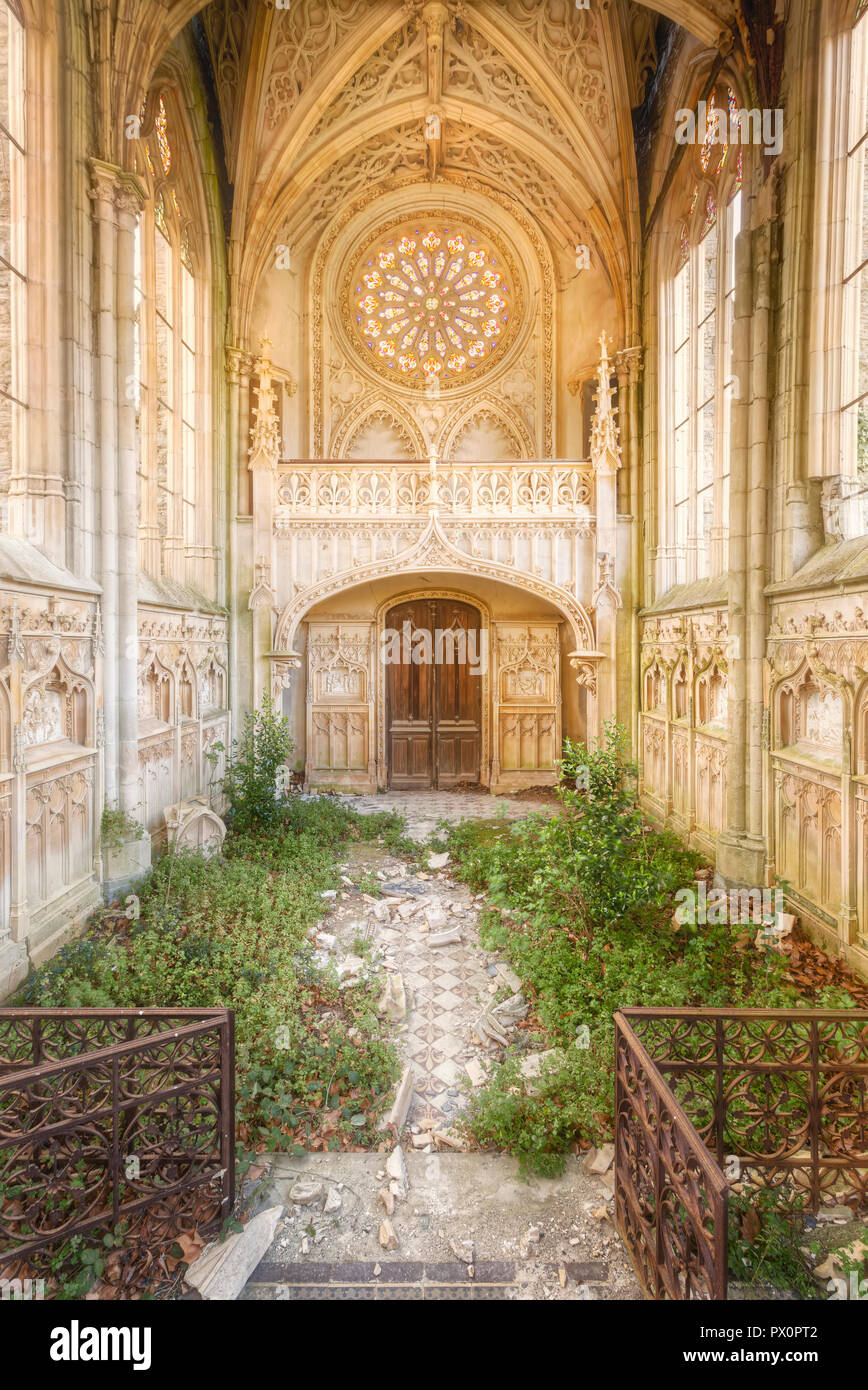 Interior view of an abandoned Gothic chapel in France Stock Photo - Alamy