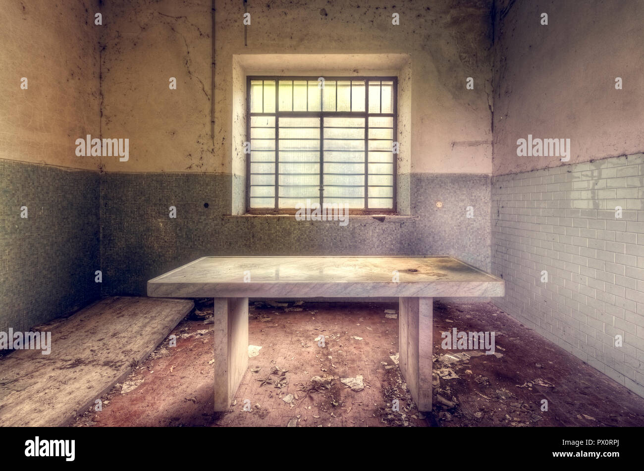 Interior view of room with an abandoned autopsy table in a morgue in ...