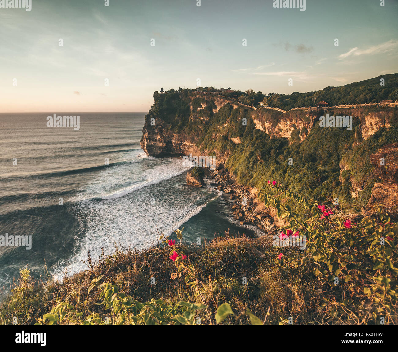 Overview panorama ocean shore, cliff. Sunset. Bali. Overwhelmed scene ...