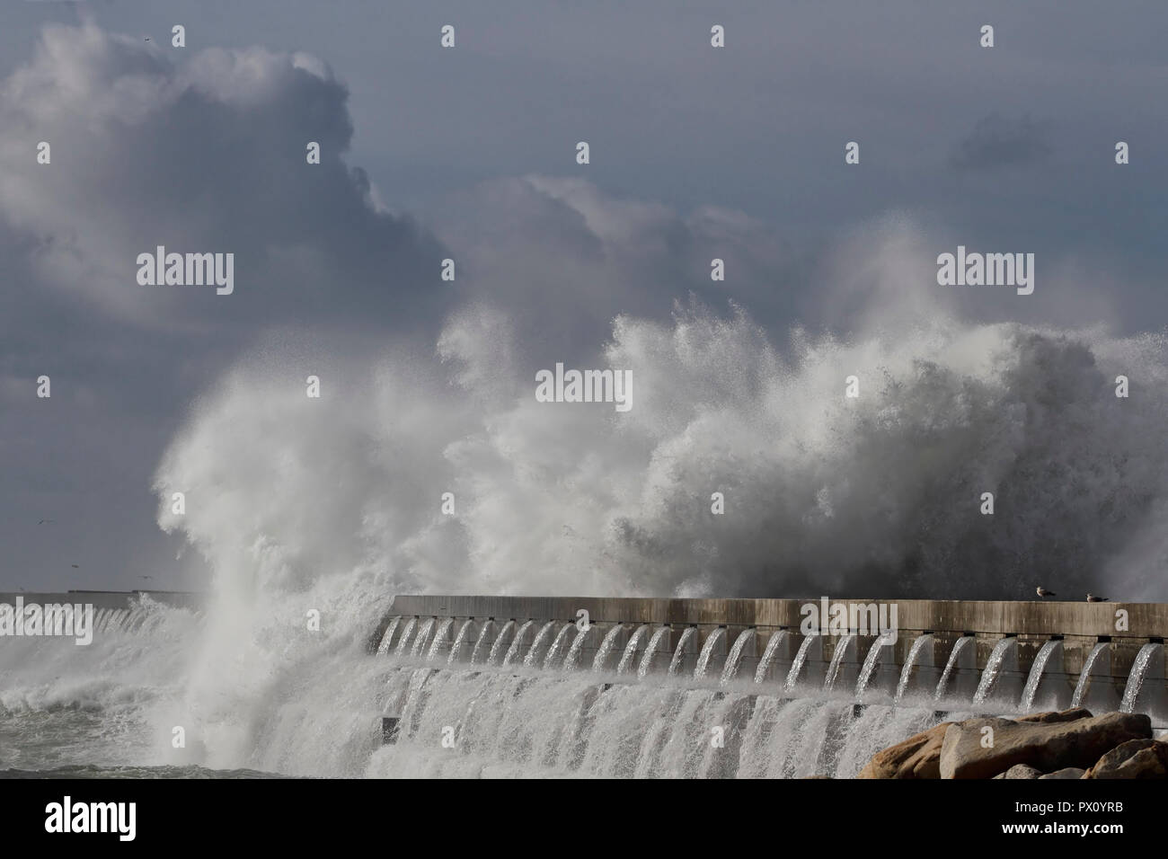 Breaking Against Breakwater High Resolution Stock Photography and ...