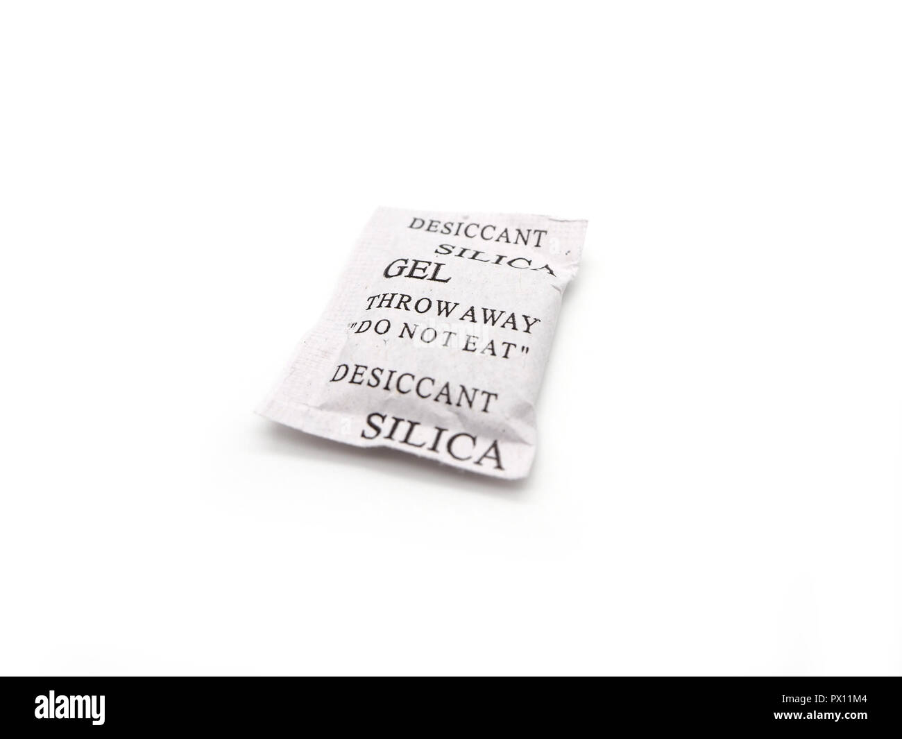 Silica gel packets isolated on a white background Stock Photo - Alamy