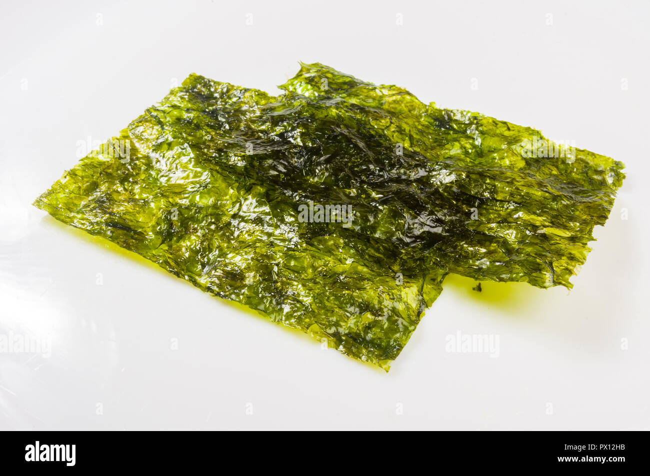 nori chips on a white ceramic plate, seaweed sheets, macro, close-up ...