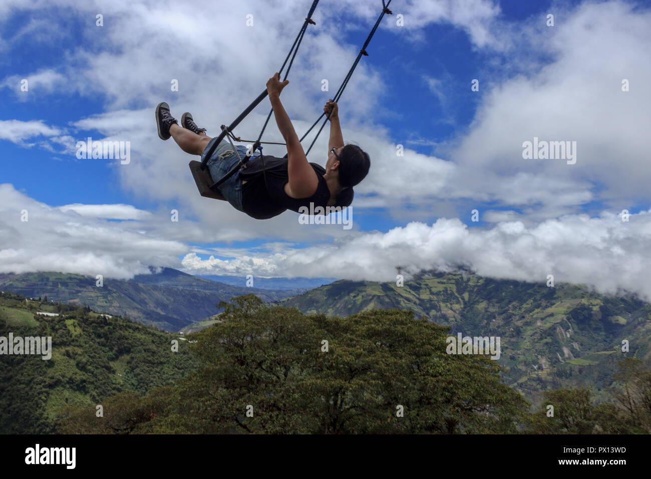 Swinging over the end of the world, ecuador Stock Photo - Alamy