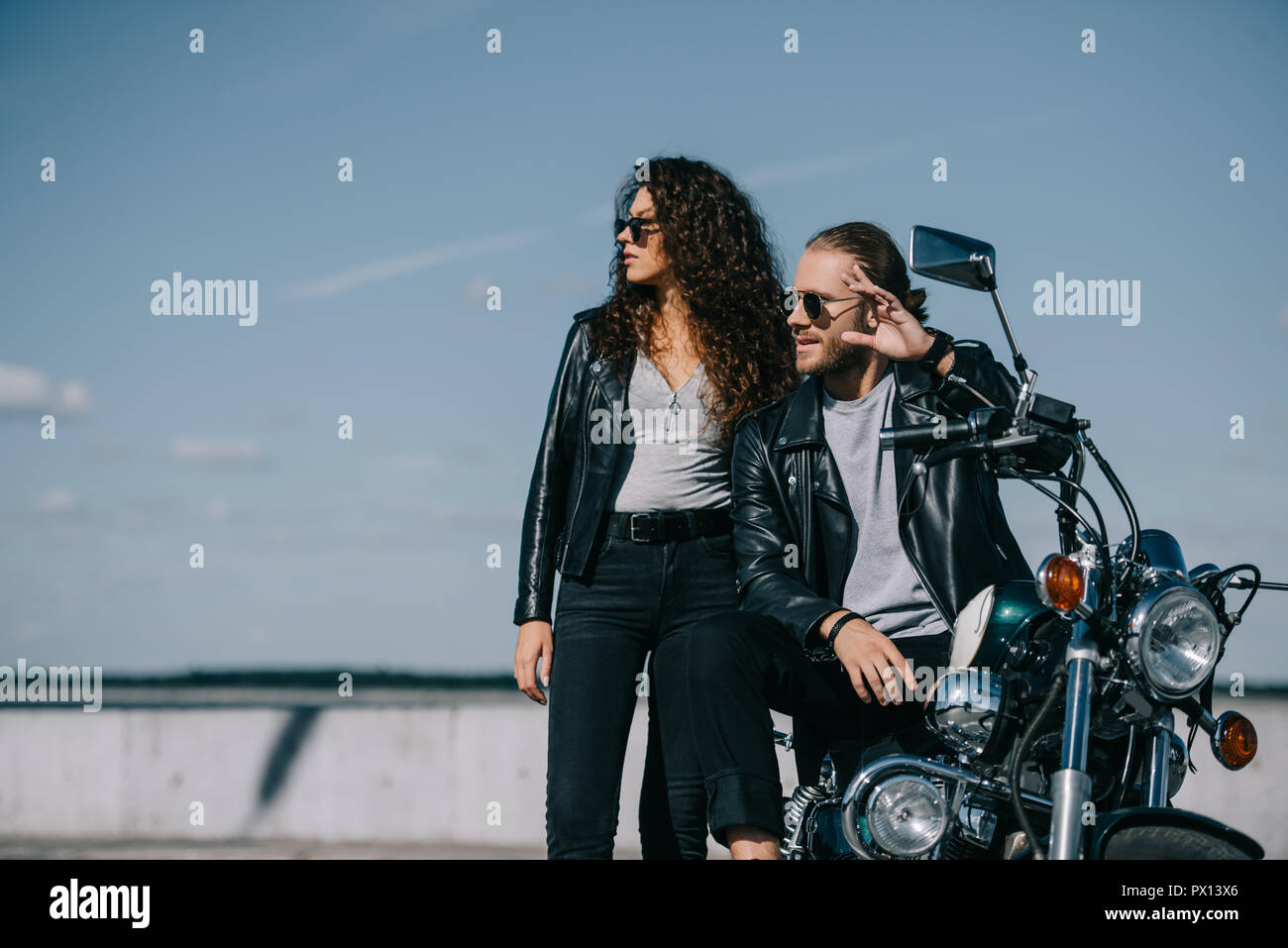 bikers in black leather jackets sitting on chopper motorcycle Stock ...