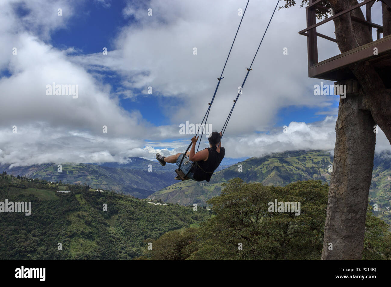 Swinging over the end of the world, ecuador Stock Photo - Alamy