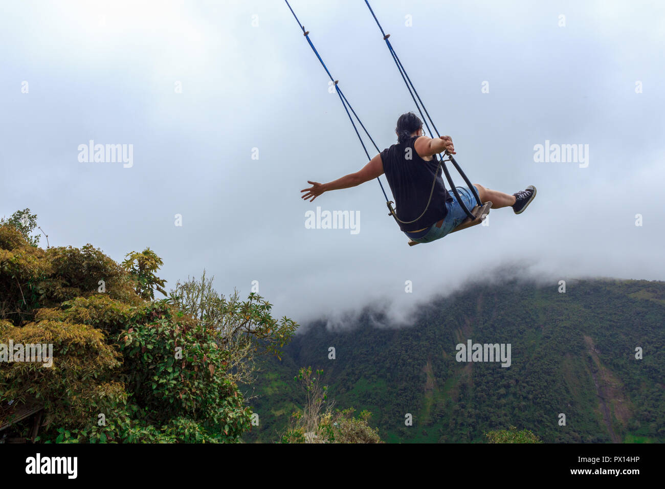 Swing at the end of the world ecuador hi-res stock photography and ...