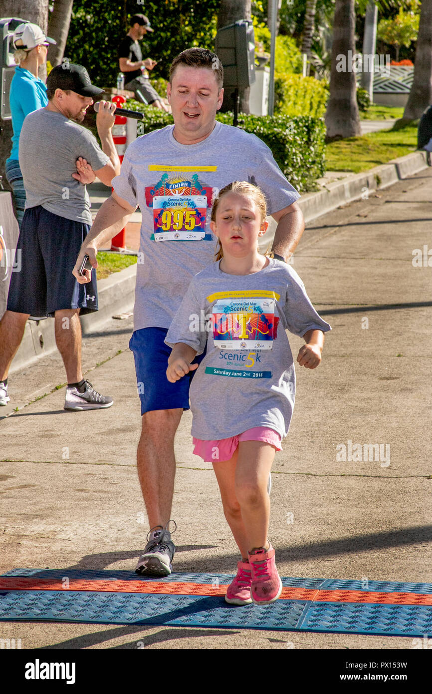 Surf City 10 Race first place winner Brandon Wolfe, right, hugs second ...