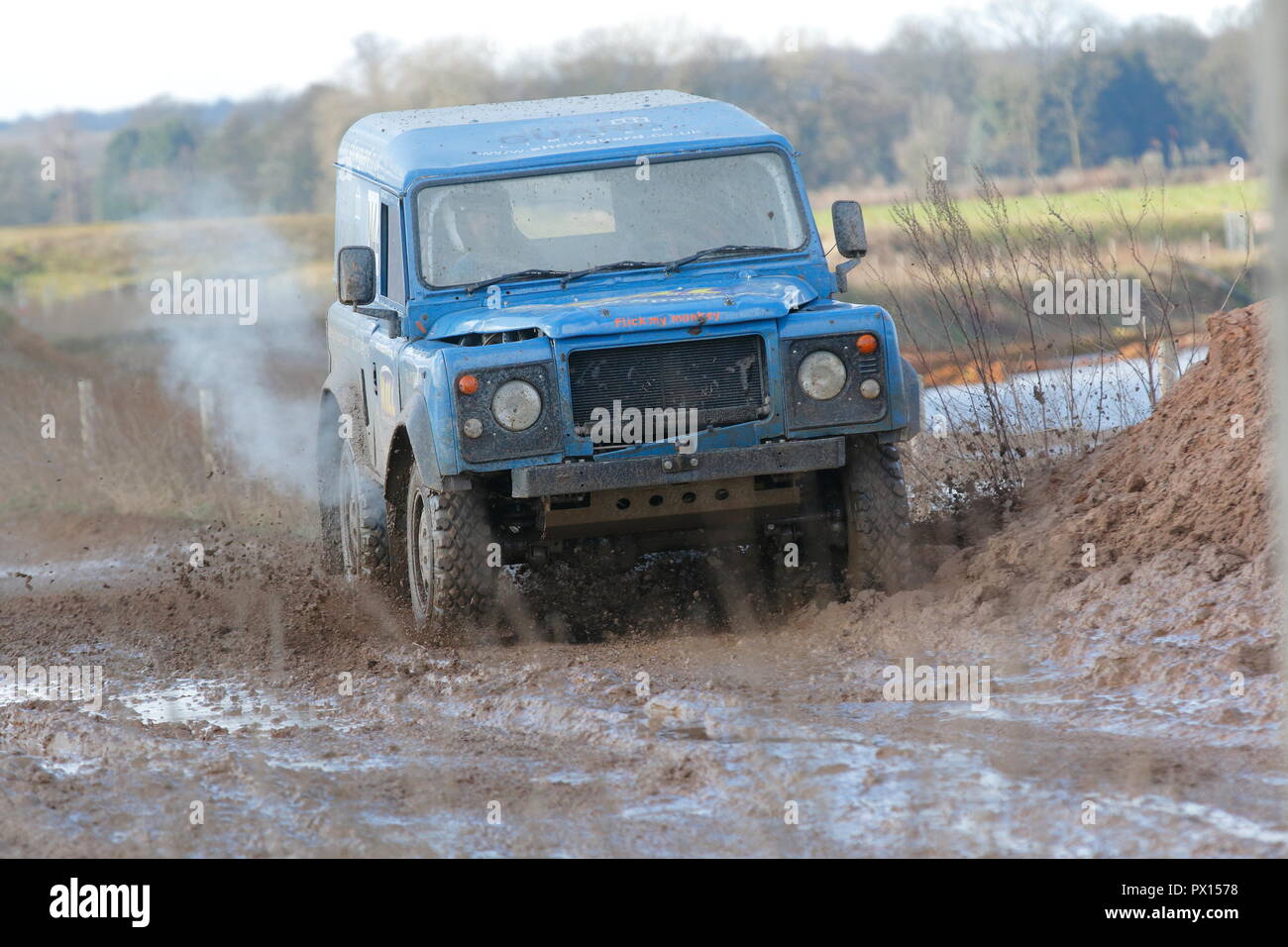 A Landrover rallying on a wet dirt track Stock Photo - Alamy