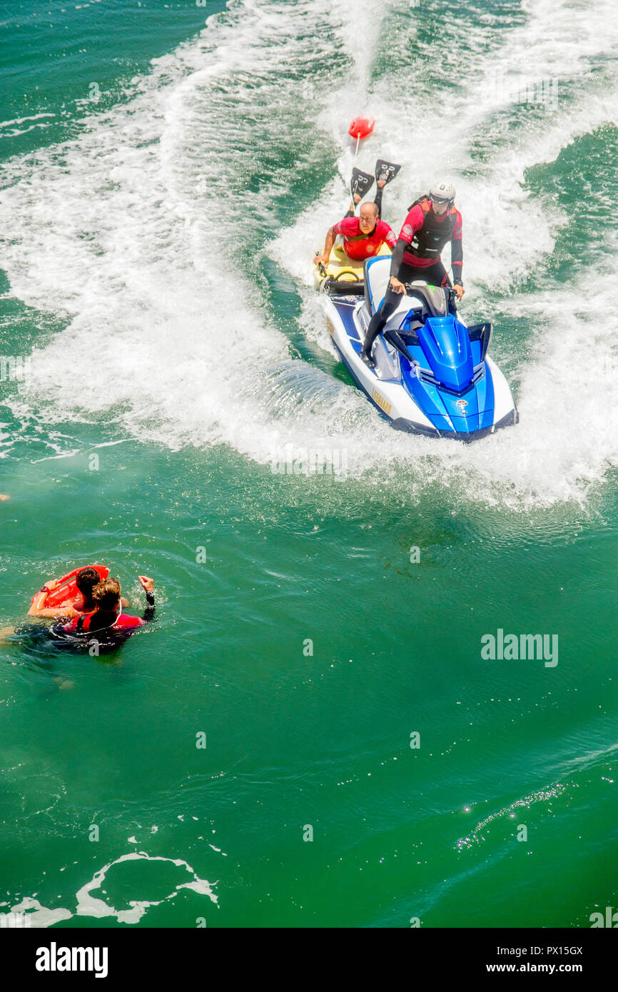 A rescue water craft arrives for a drowning victim and a lifeguard in ...