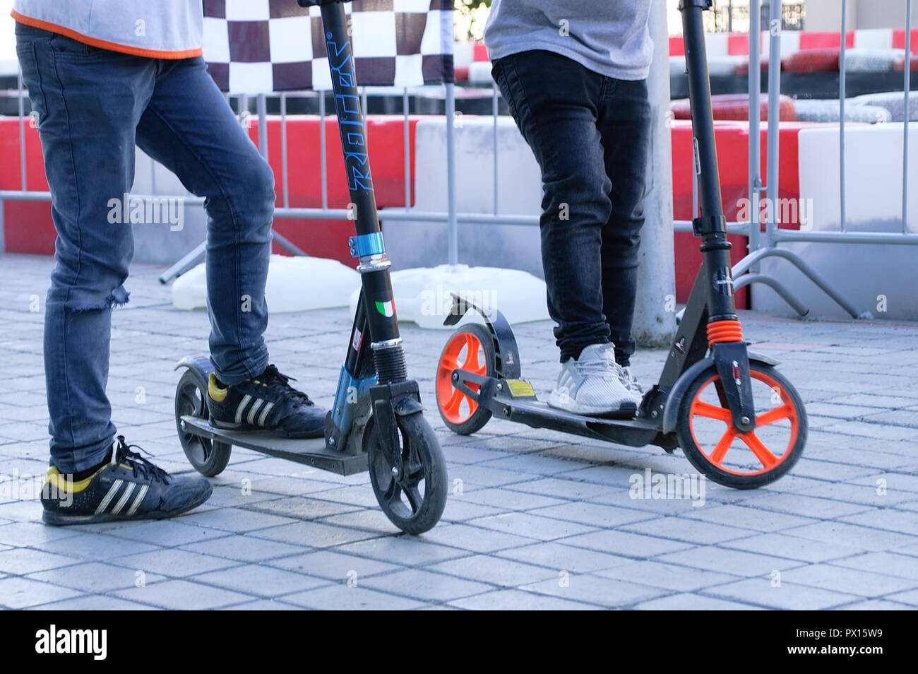 Kids ride scooters hi-res stock photography and images - Alamy