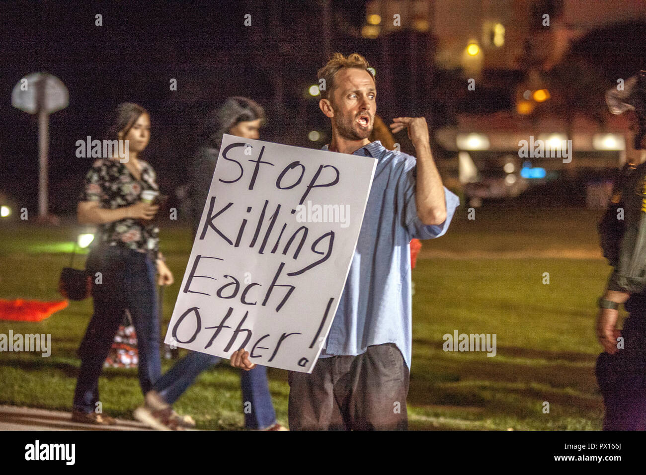Carrying a sign saying "Stop Killing Each Other!" a pacifist ...