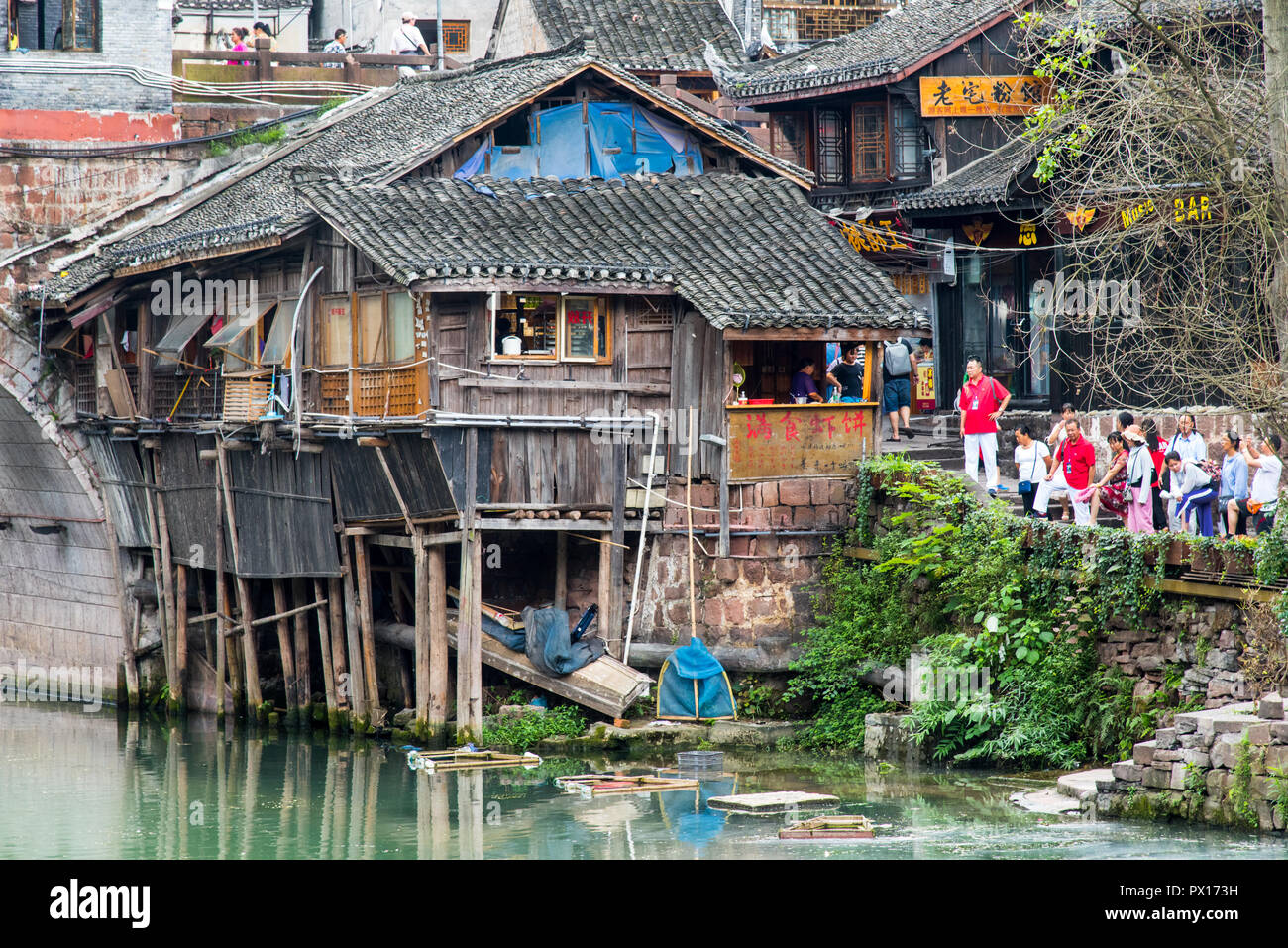 FENGHUANG, HUNAN, CHINA - 8JUL2018: Old building beside the Tuojiang ...