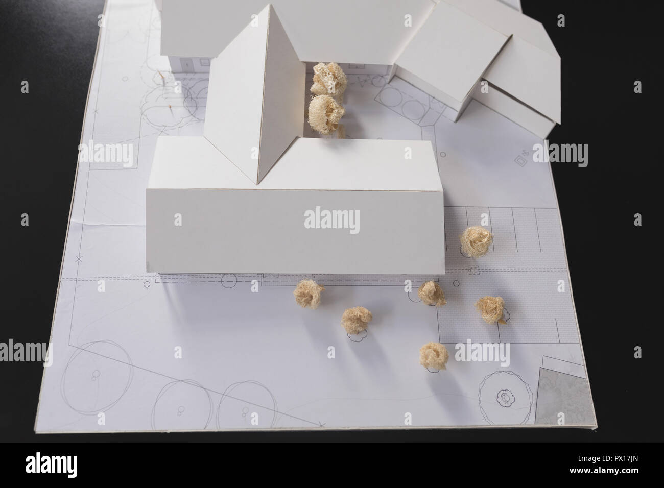 House model with crumpled paper on desk Stock Photo - Alamy