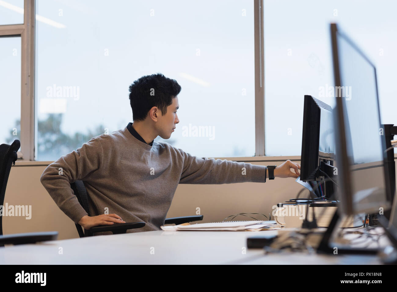 Businessman working on desktop pc Stock Photo - Alamy